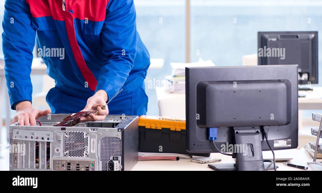Computer repairman specialist repairing computer desktop Stock Photo ...