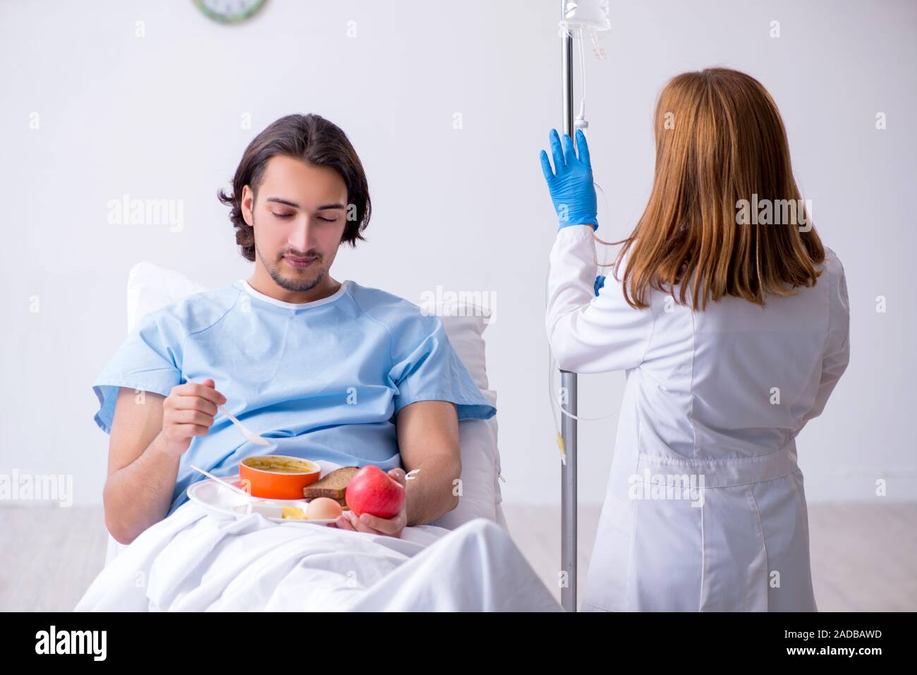 Male patient eating food in the hospital Stock Photo - Alamy