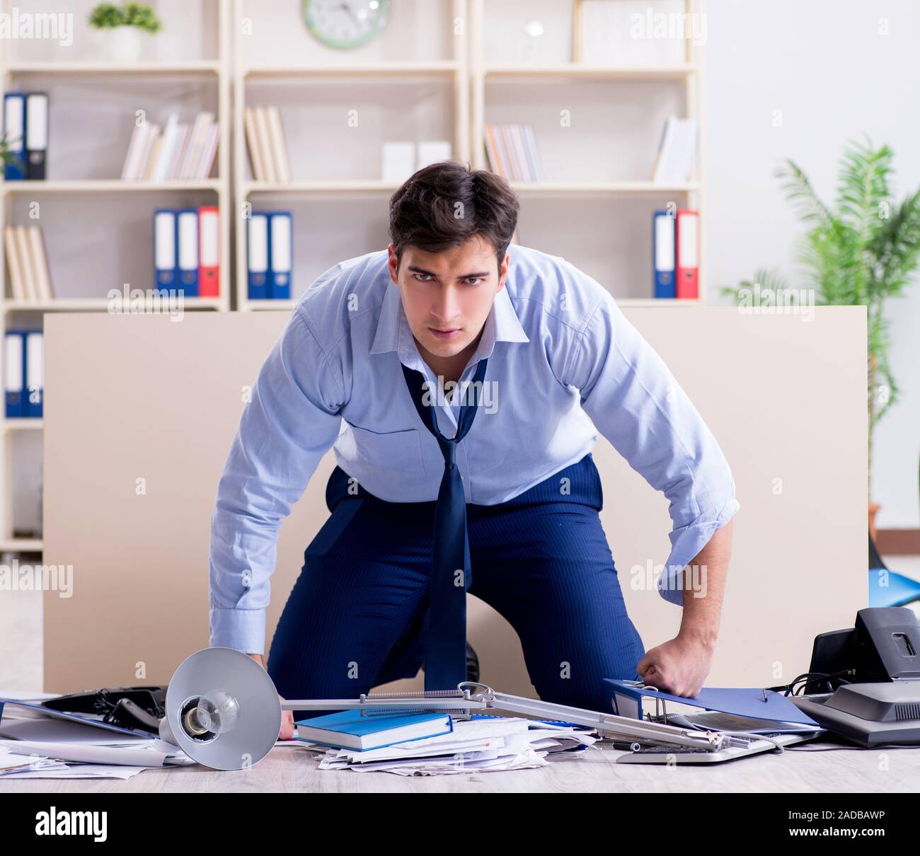 Angry Businessman frustrated with too much work Stock Photo - Alamy
