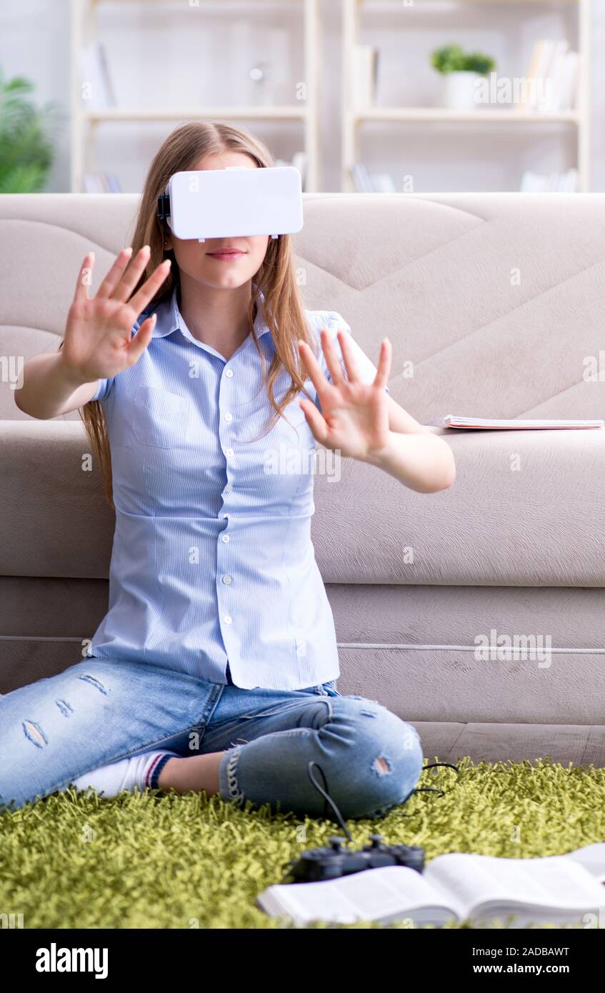 Young girl playing virtual reality games Stock Photo - Alamy