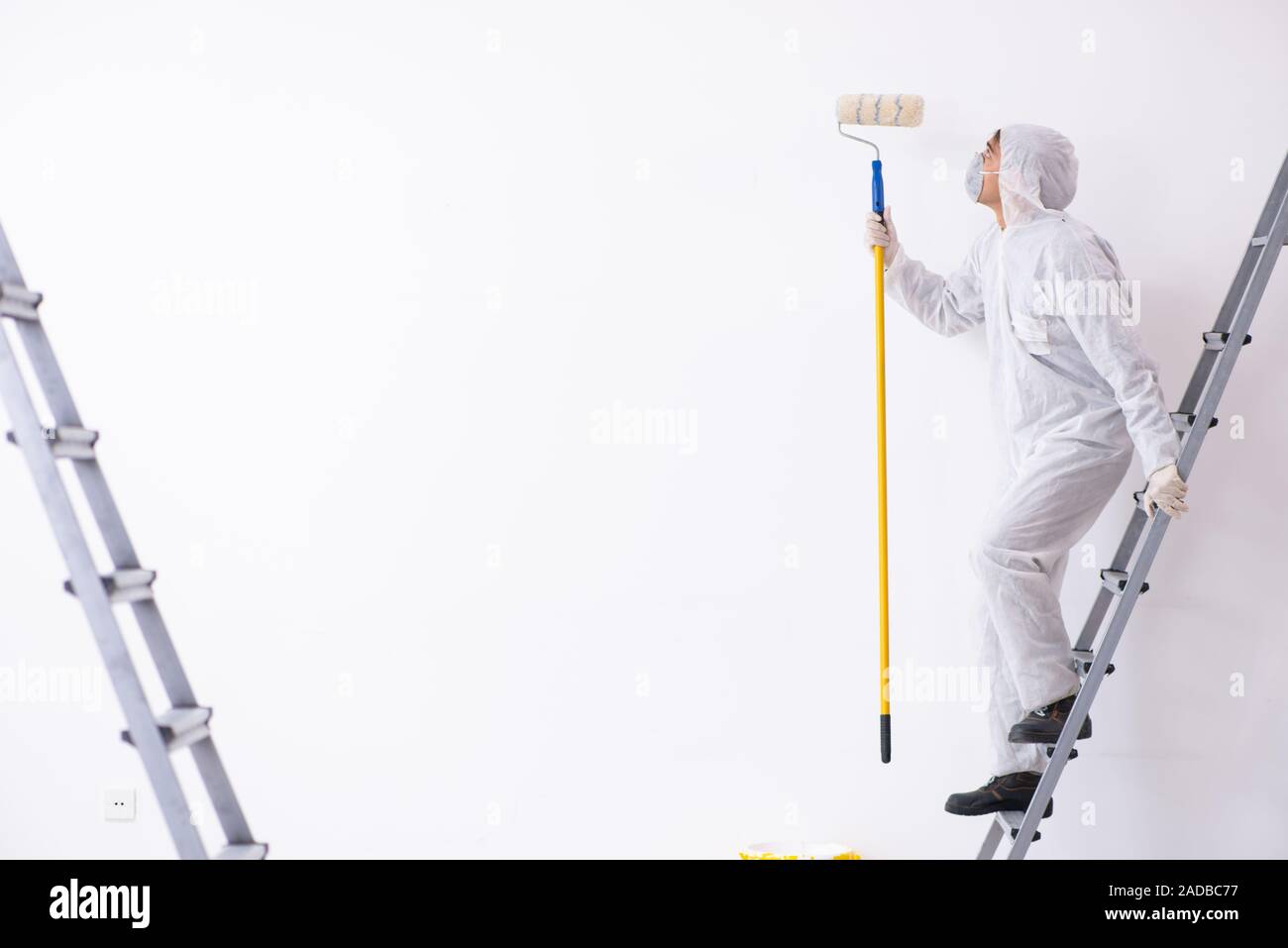 Painter working at construction site Stock Photo - Alamy