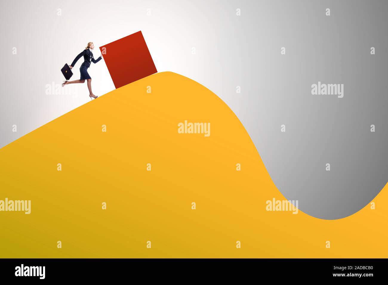 Woman pushing cube towards the top hi-res stock photography and images ...