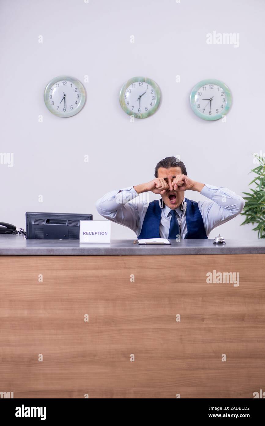 Tired receptionist hi-res stock photography and images - Alamy