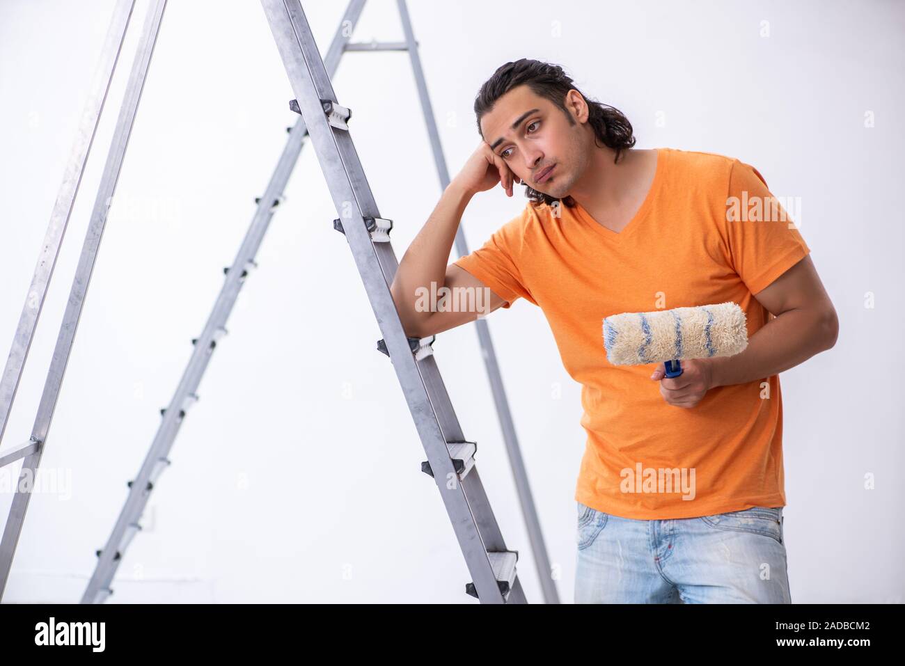 Young man contractor doing renovation at home Stock Photo - Alamy