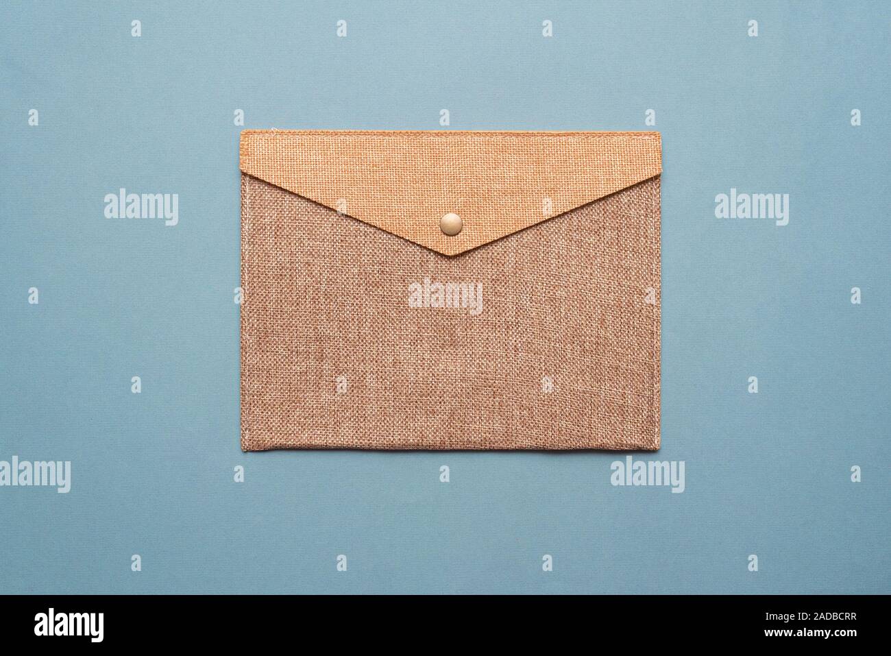 Brown mail envelope on blue flat lay background Stock Photo - Alamy