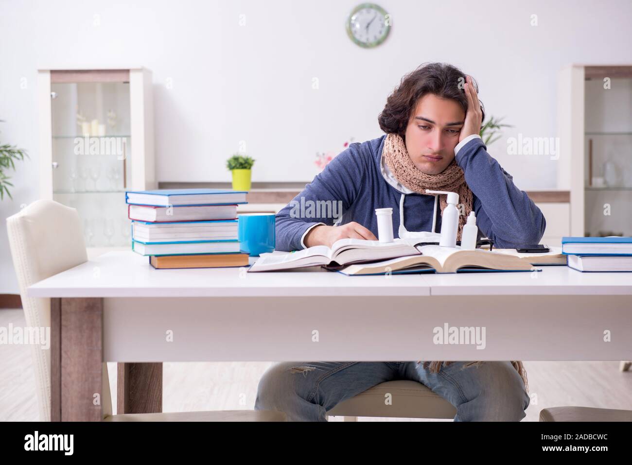 Sick male student suffering at home Stock Photo - Alamy