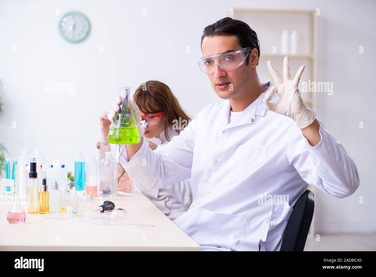 Two chemists working in the lab Stock Photo - Alamy