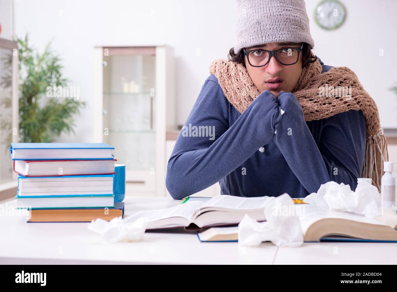 Sick male student suffering at home Stock Photo - Alamy