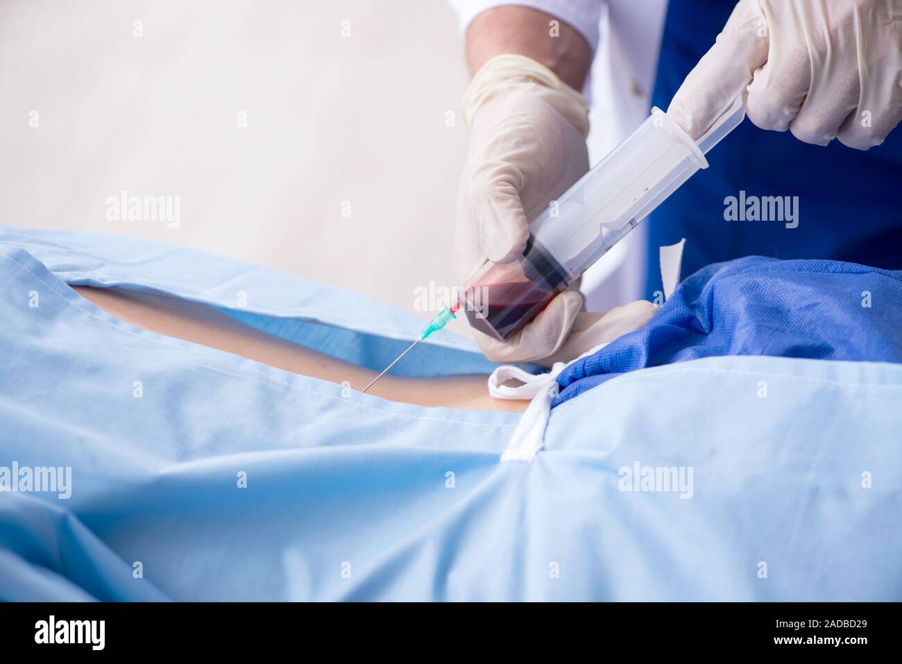 Female patient getting an injection in the clinic Stock Photo - Alamy