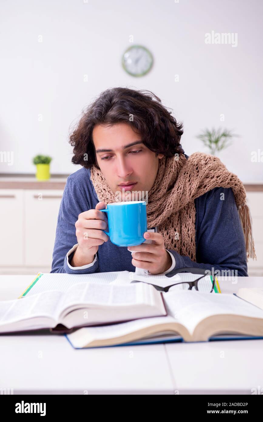Sick male student suffering at home Stock Photo - Alamy