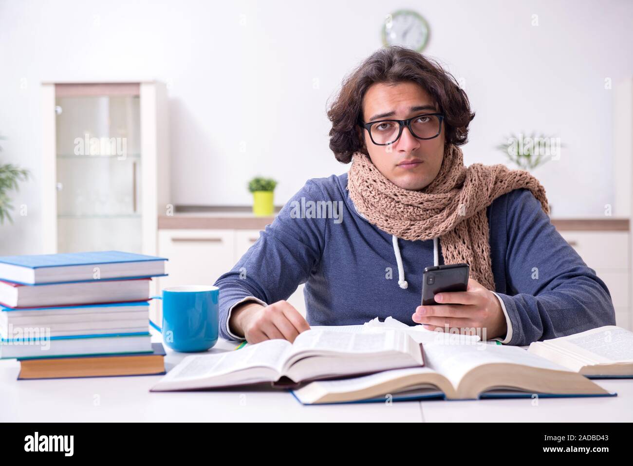 Sick male student suffering at home Stock Photo - Alamy