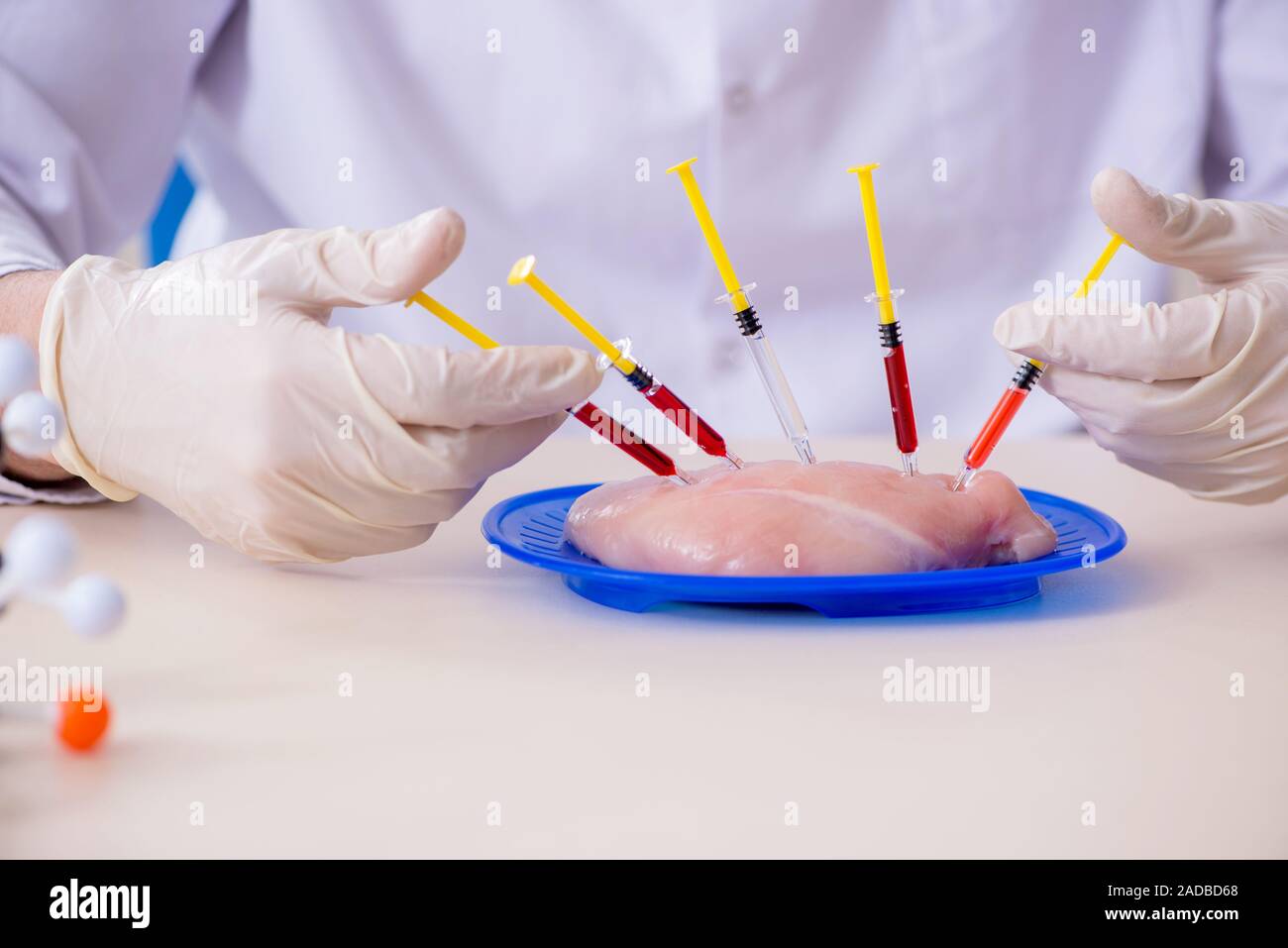 Male nutrition expert testing food products in lab Stock Photo - Alamy