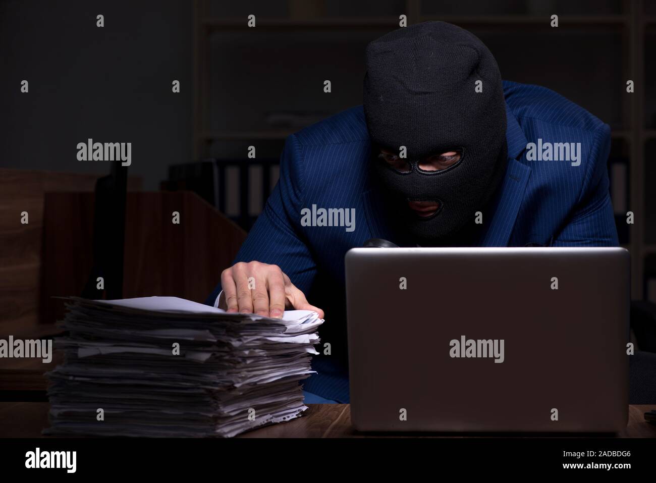 Male employee stealing information in the office night time Stock Photo ...