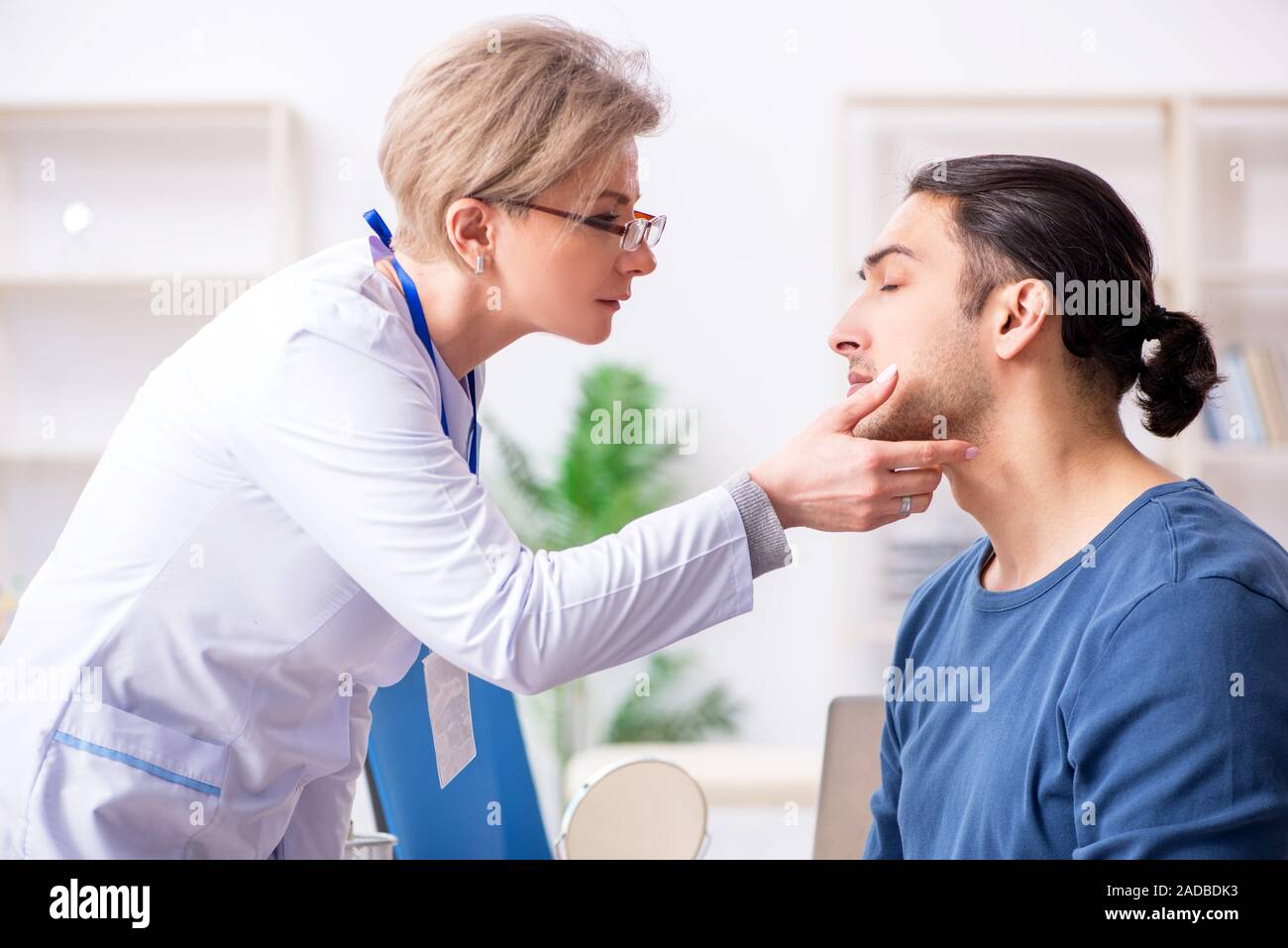Young patient visiting doctor in hospital Stock Photo - Alamy