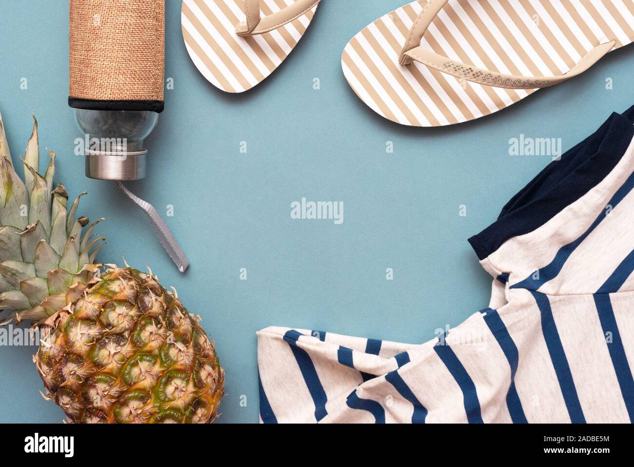 Summer vacation background with copy space. Pineapple, flip flops ...