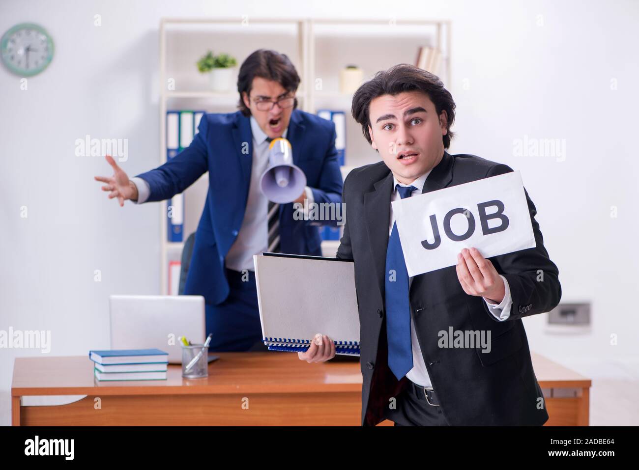 Boss and his male assistant working in the office Stock Photo - Alamy
