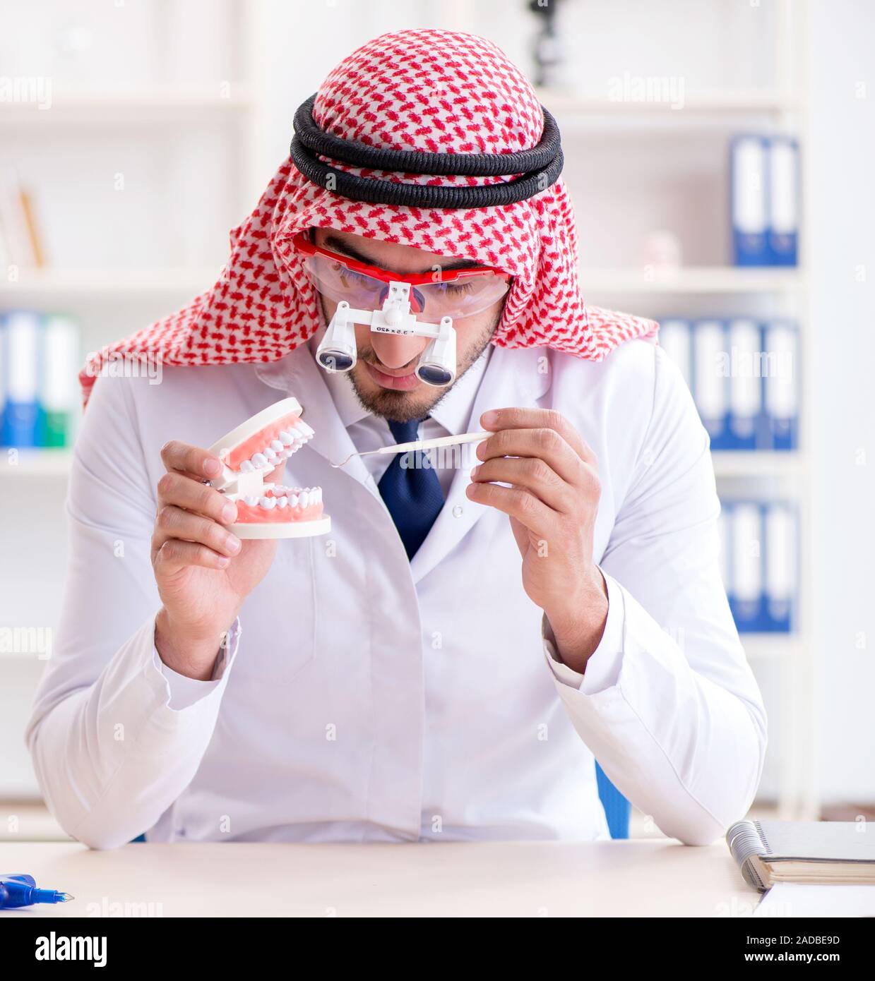 Arab dentist working on new teeth implant Stock Photo - Alamy