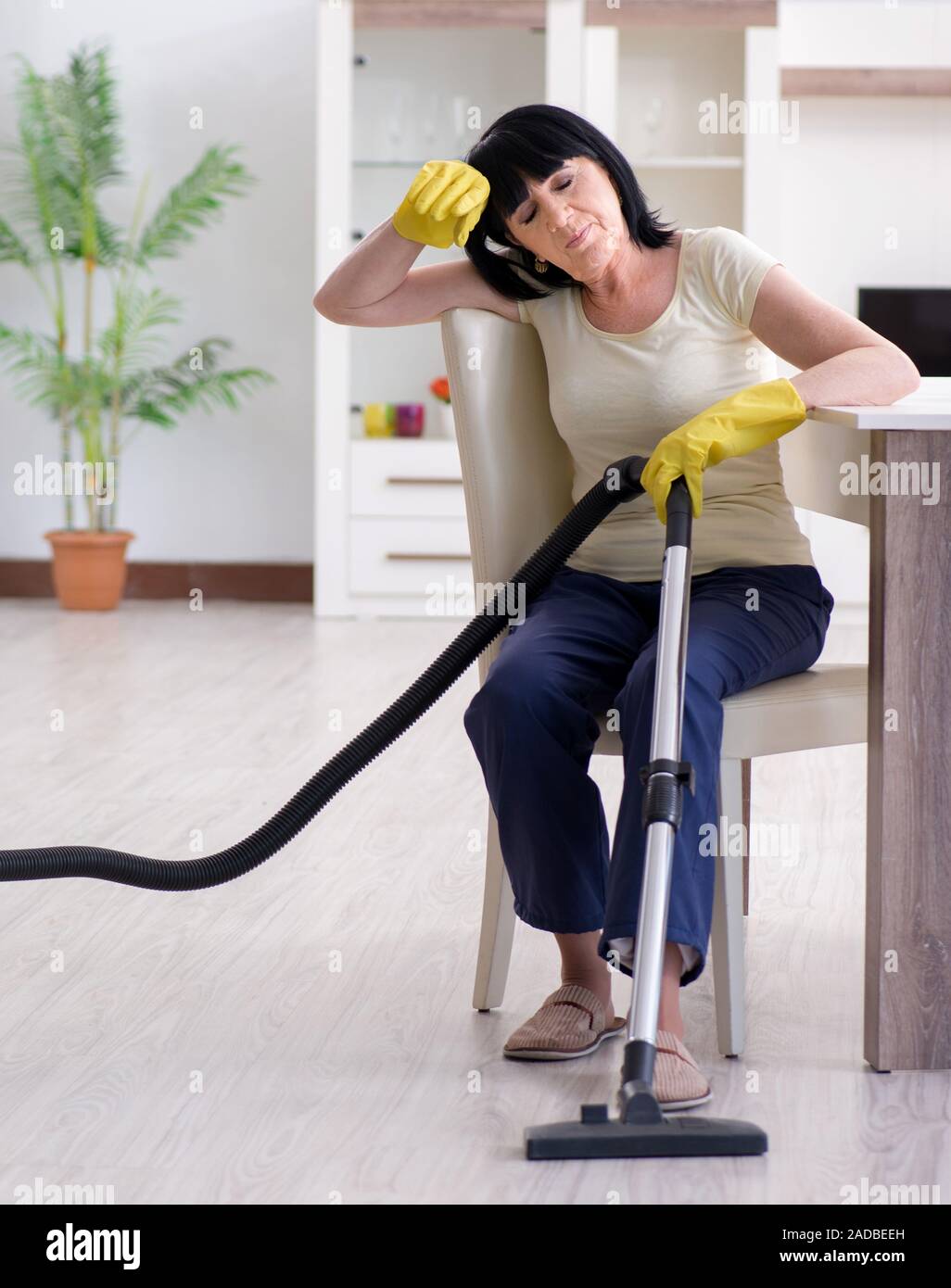 Broom senior sweeping hi-res stock photography and images - Alamy