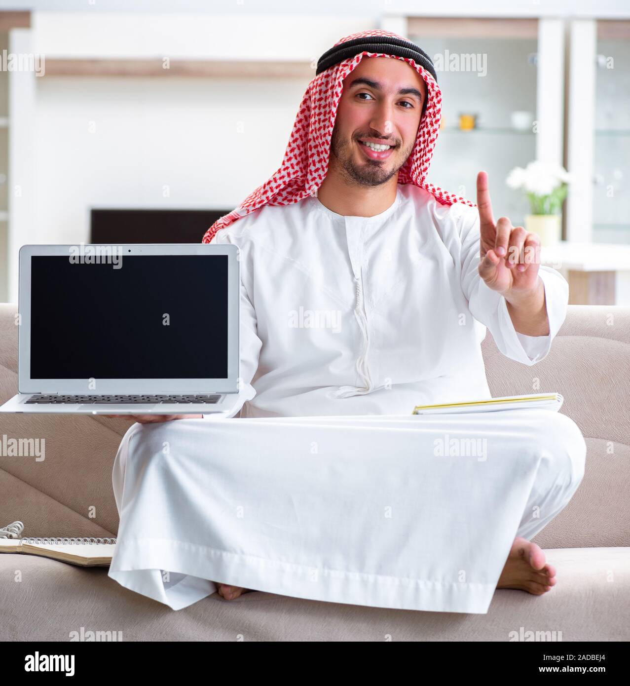 Arab man working at home on his work Stock Photo - Alamy