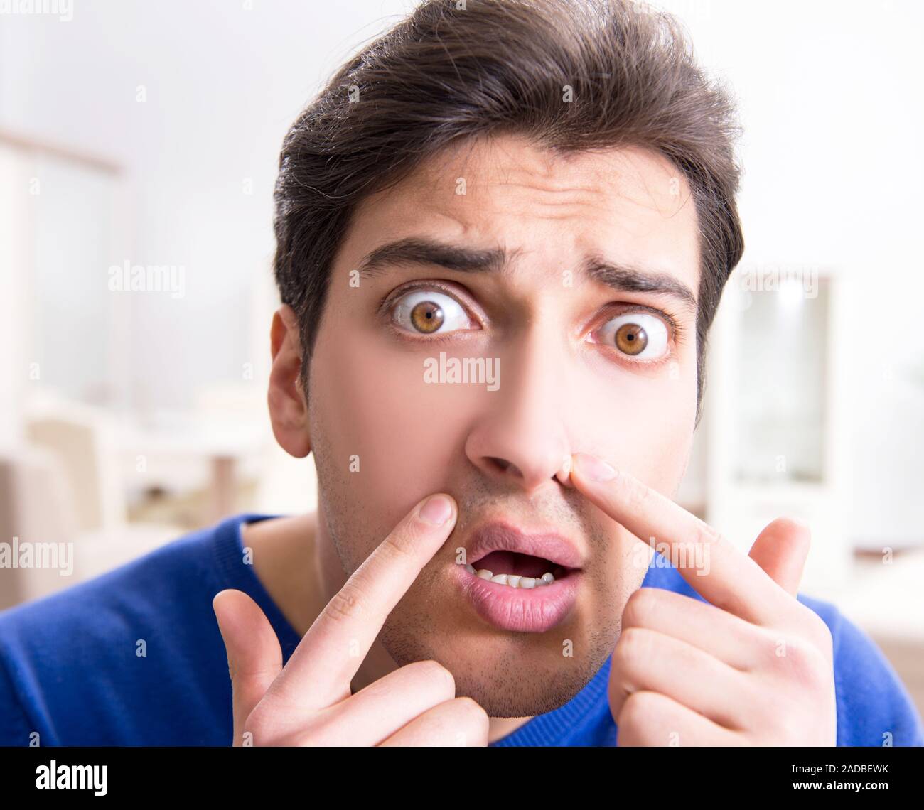 Shocked young man panicking hi-res stock photography and images - Alamy