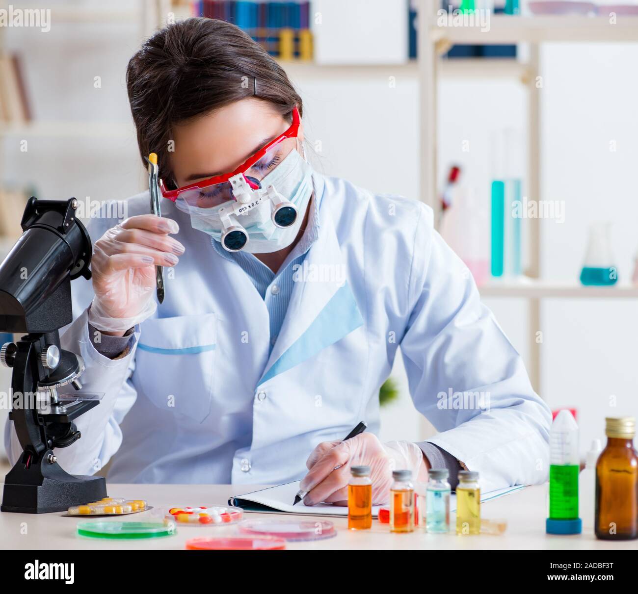 Lab assistant in drug synthesis concept Stock Photo - Alamy