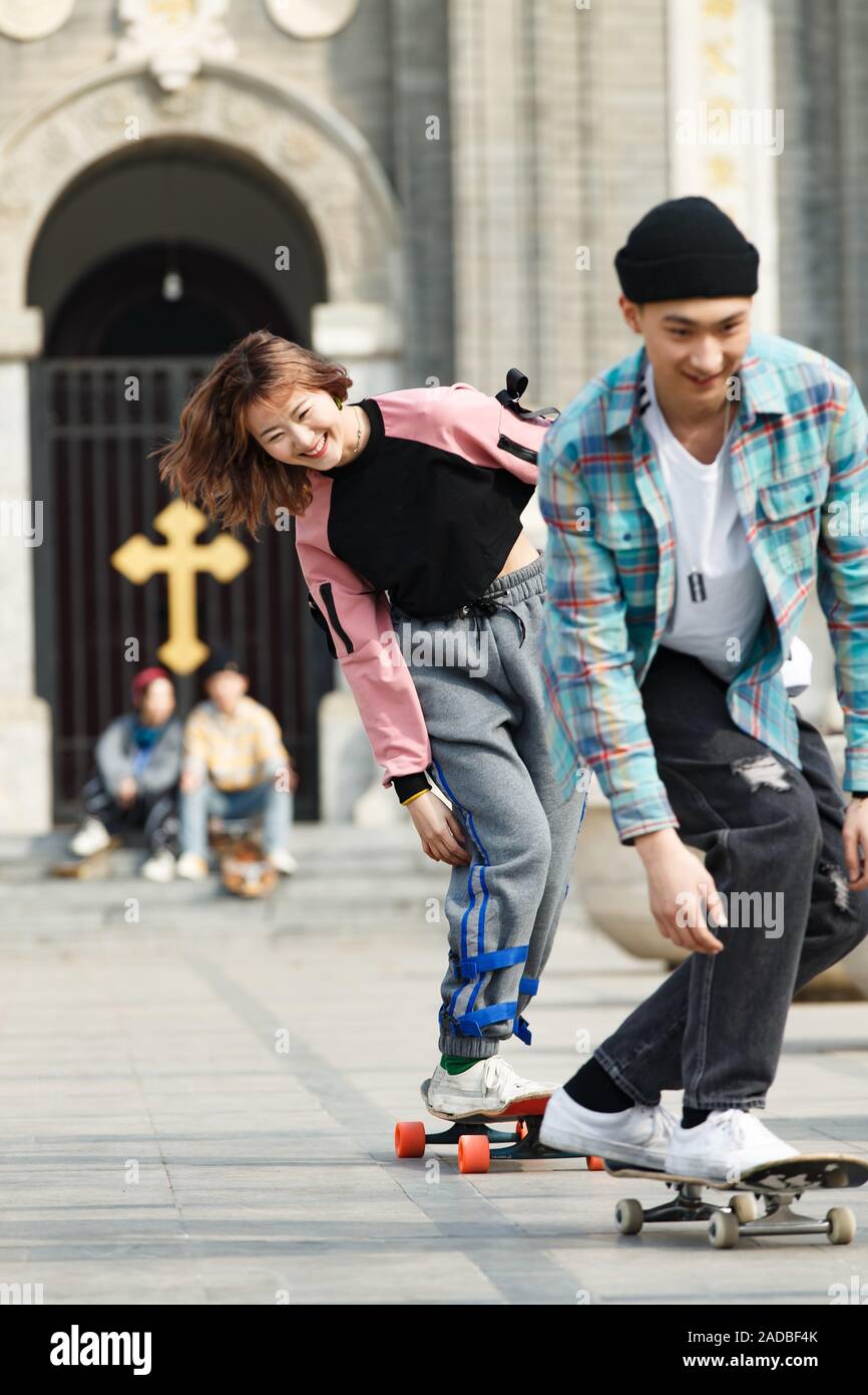 Young people skateboarding Stock Photo - Alamy