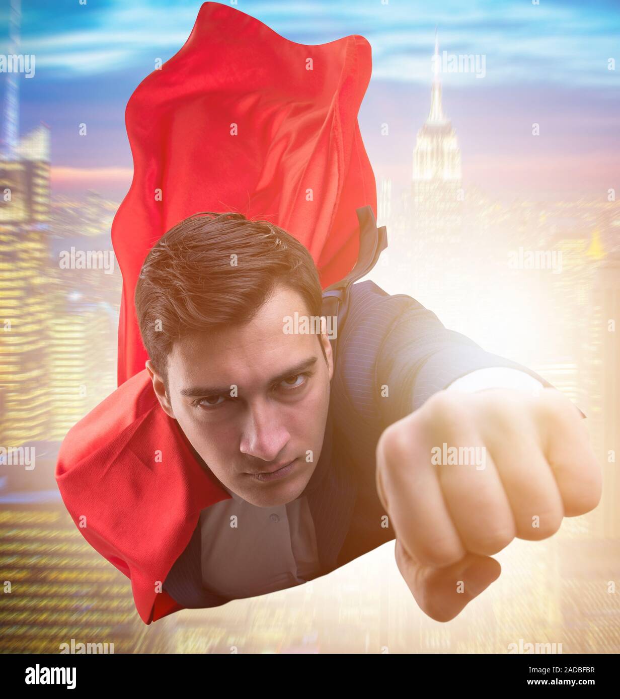 Flying super hero over the city Stock Photo - Alamy