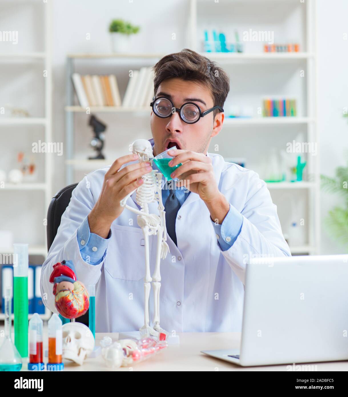 Funny doctor having fun in hospital lab Stock Photo - Alamy