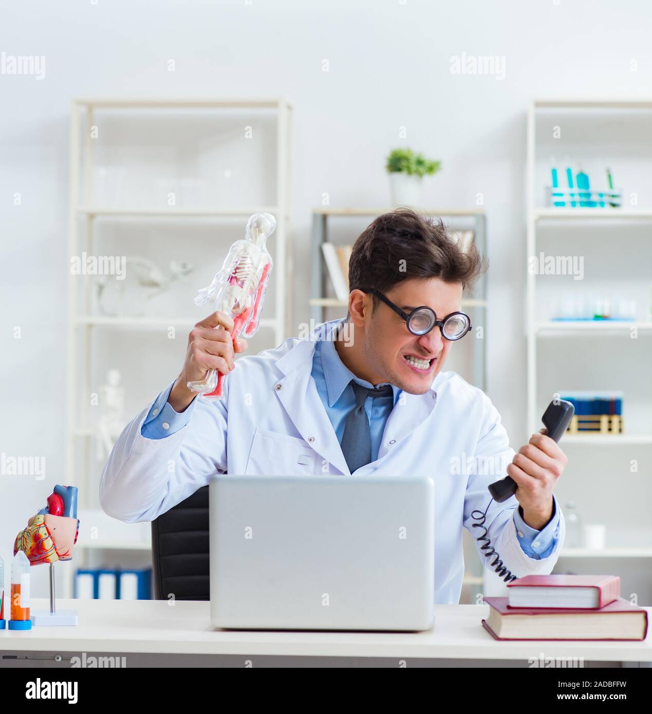 Funny doctor having fun in hospital lab Stock Photo - Alamy
