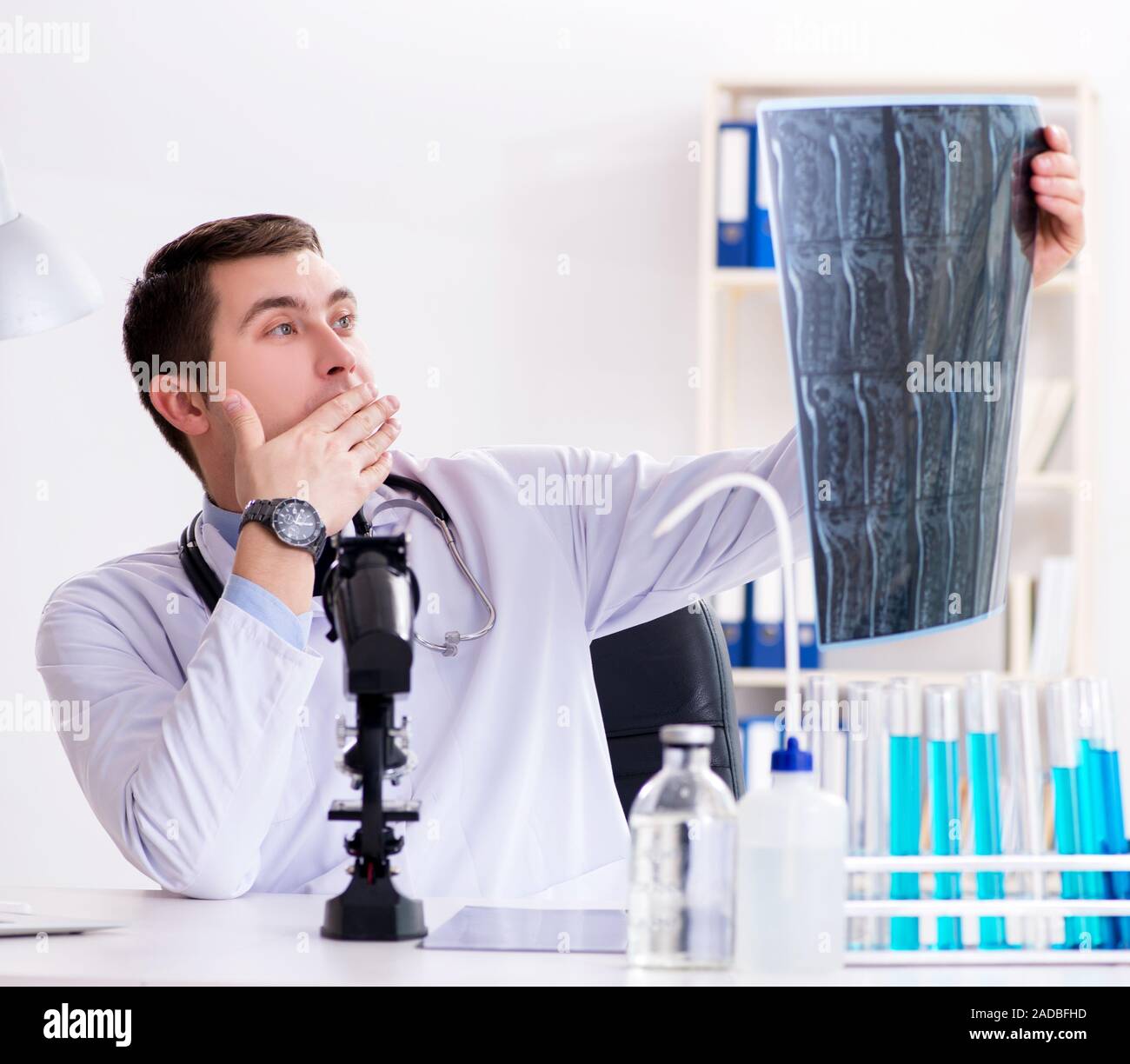 Male researcher examining medical scan hi-res stock photography and ...