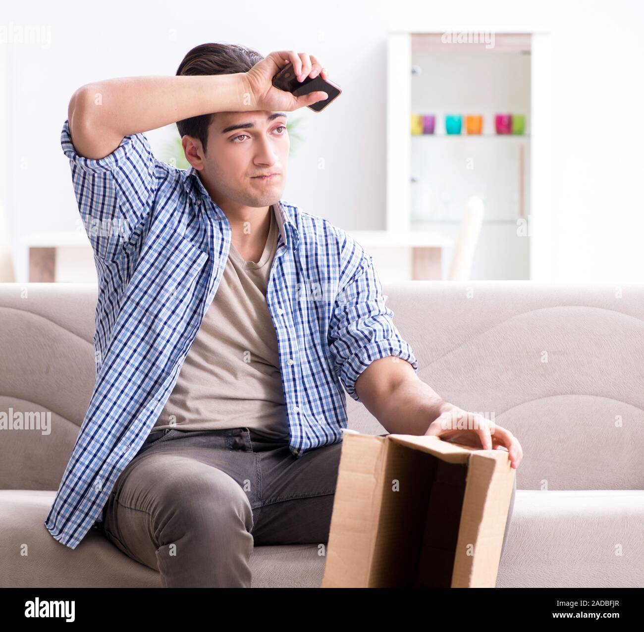 Man receiving empty parcel with stolen goods Stock Photo - Alamy
