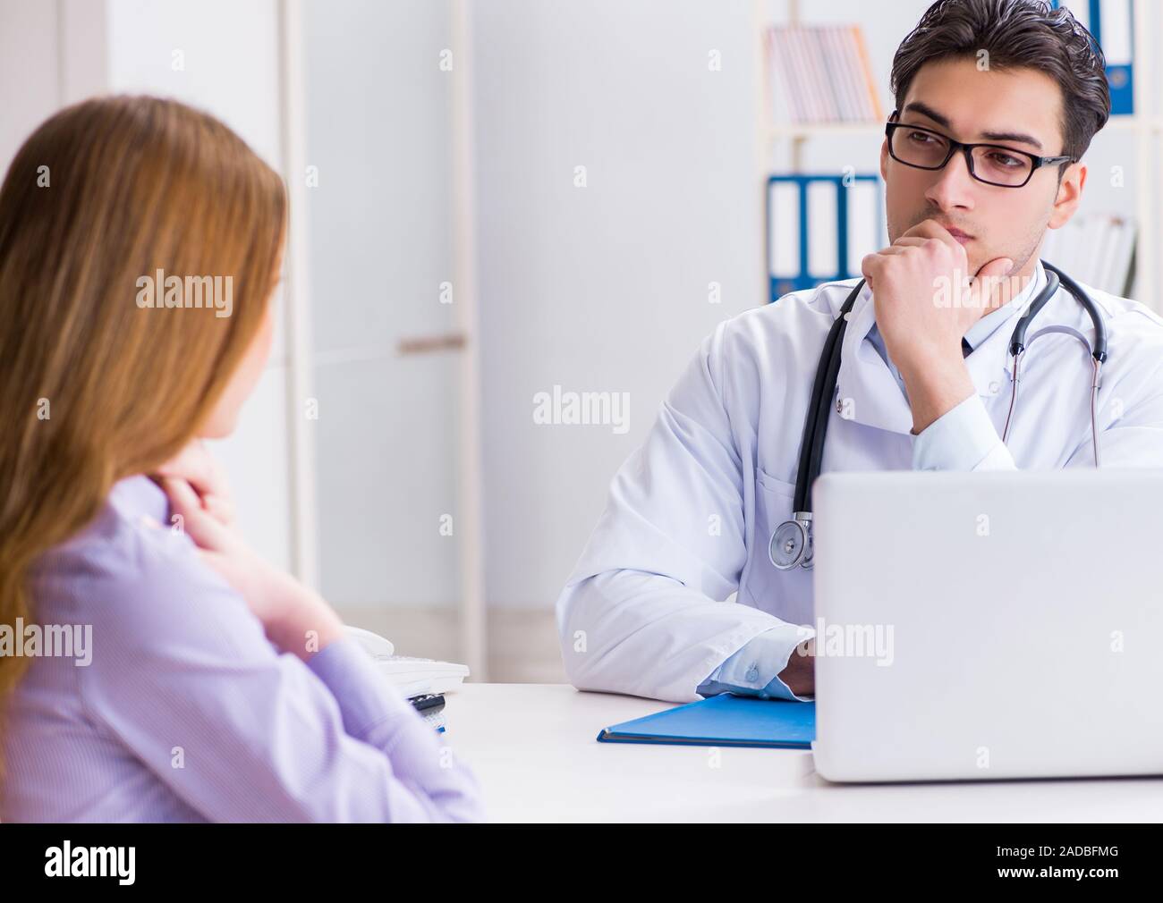 Patient visiting doctor for medical check-up in hospital Stock Photo ...