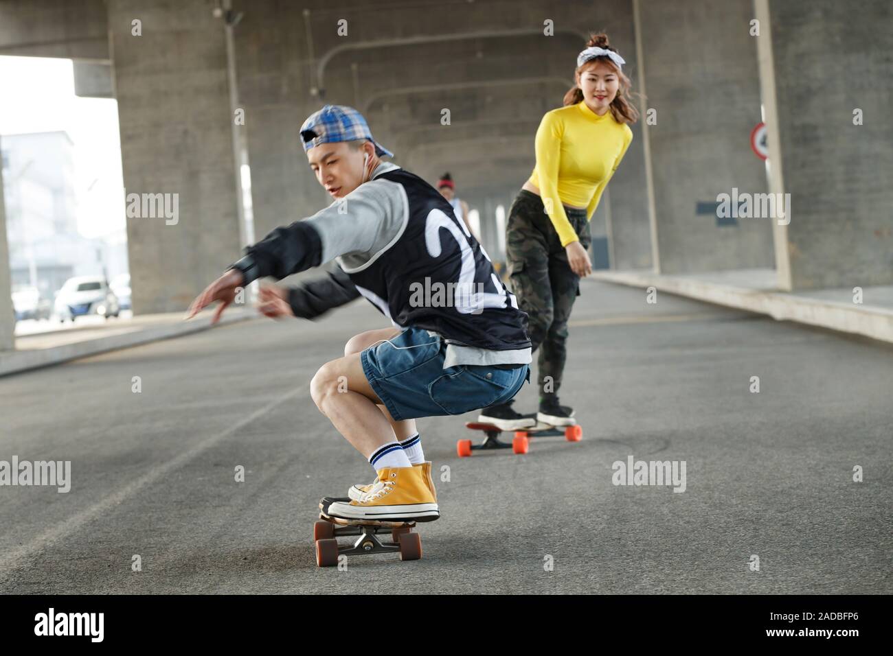 Young people skateboarding Stock Photo - Alamy
