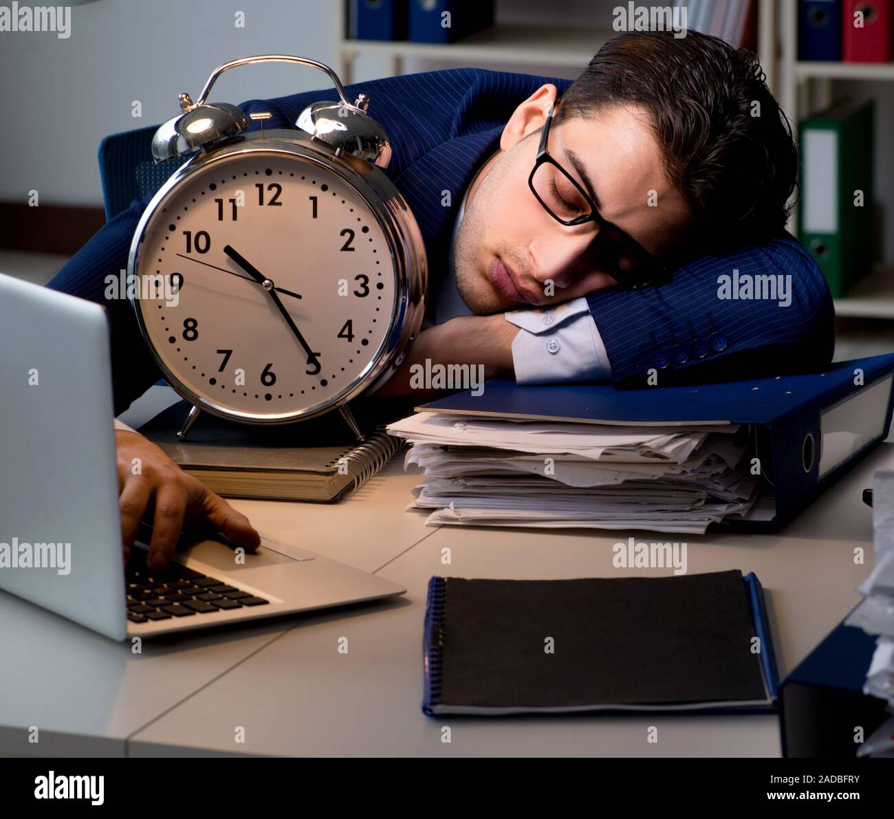 The Businessman falling asleep during long hours in office Stock Photo ...
