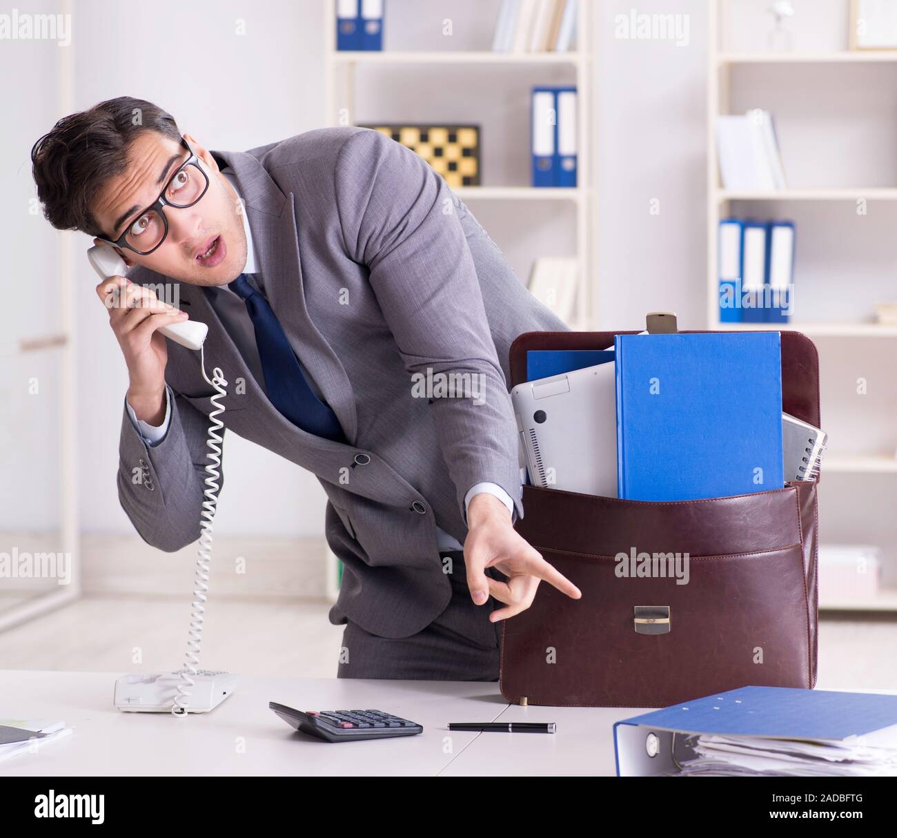 Employee with too much work taking it home Stock Photo - Alamy