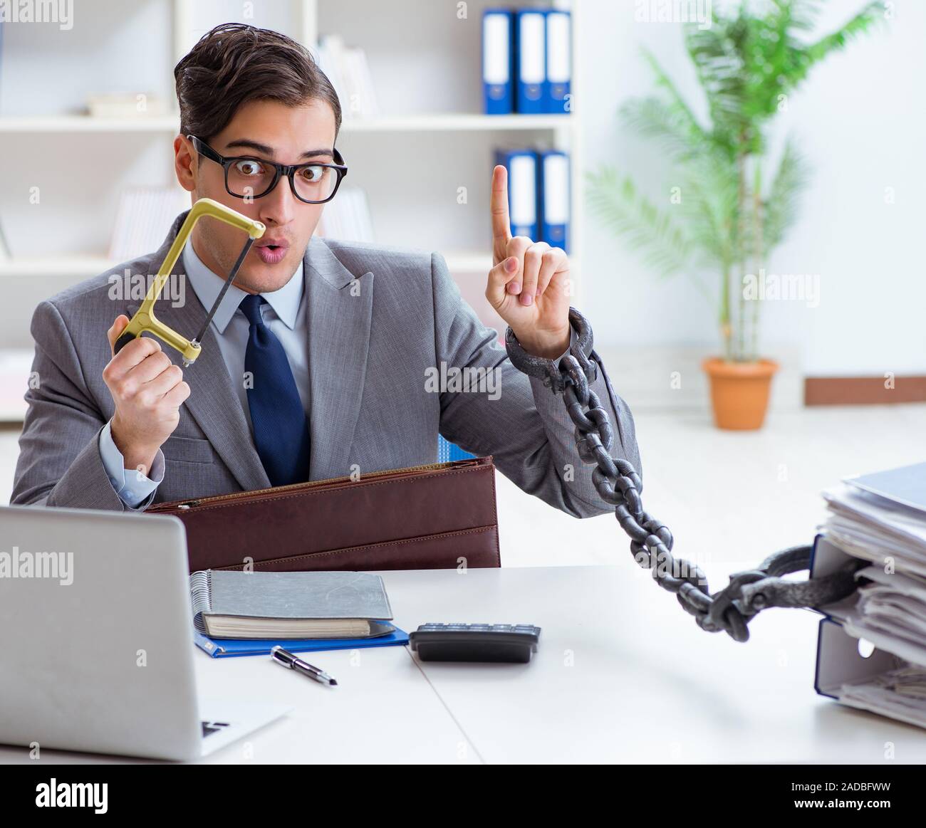 Man chained to desk hi-res stock photography and images - Alamy