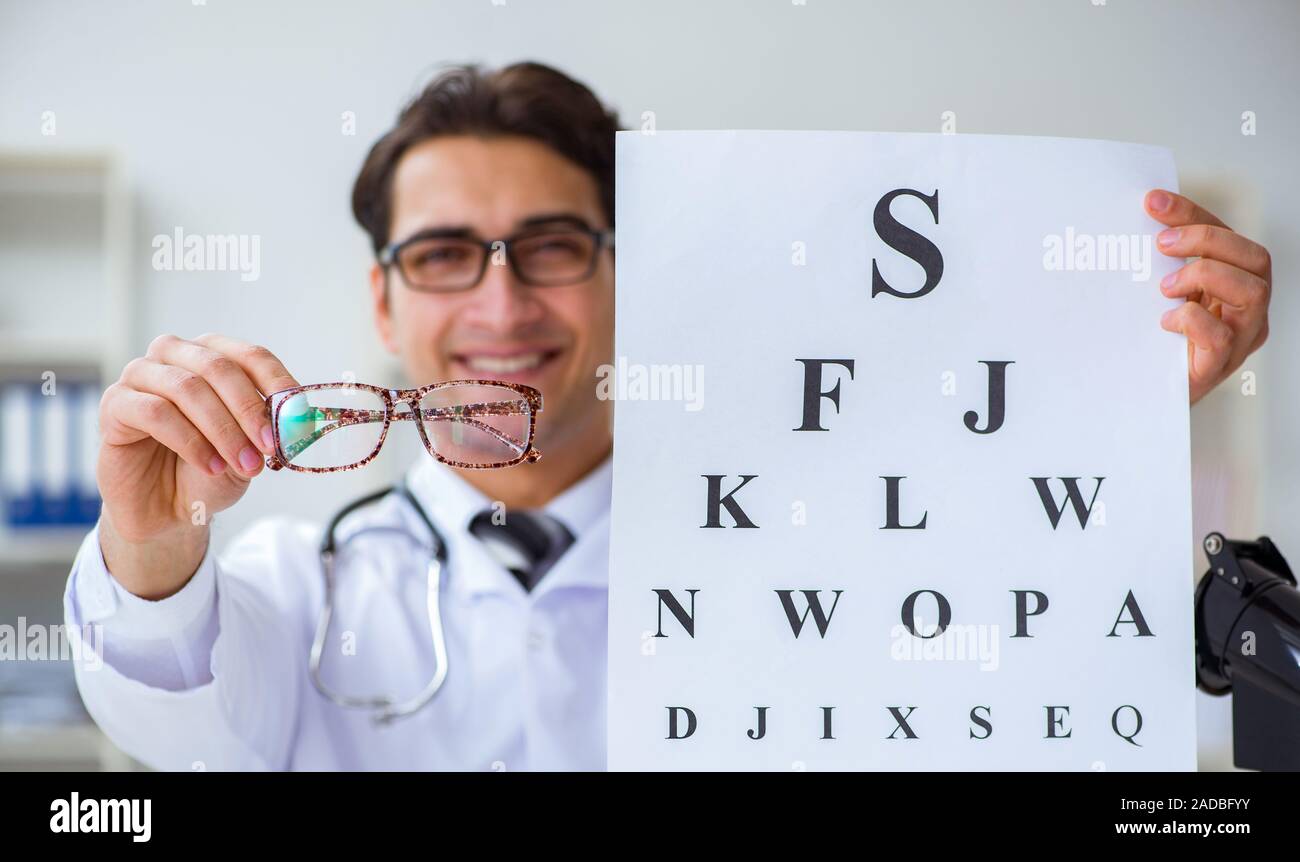 Eye doctor in medical concept Stock Photo - Alamy