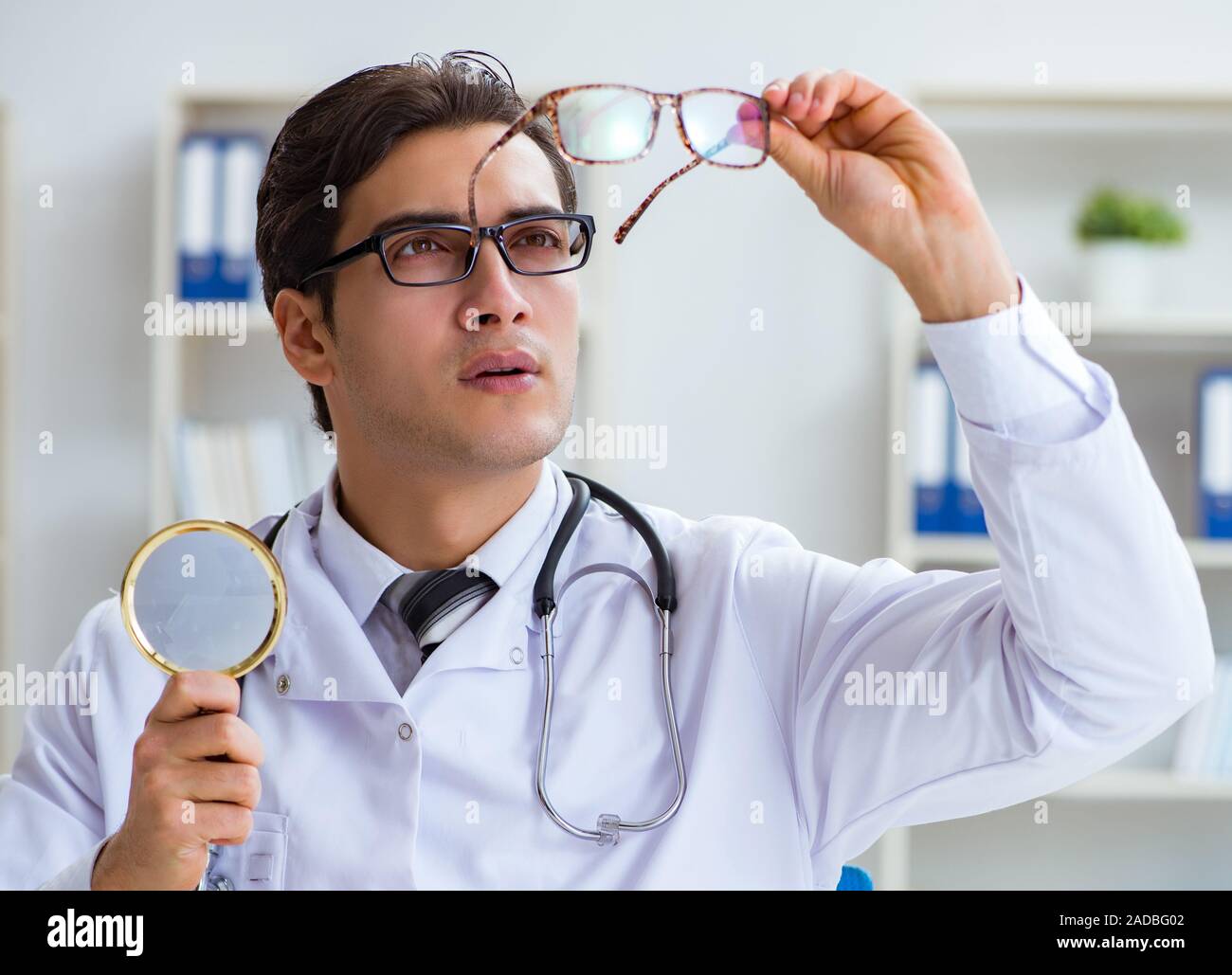 Eye doctor in medical concept Stock Photo - Alamy