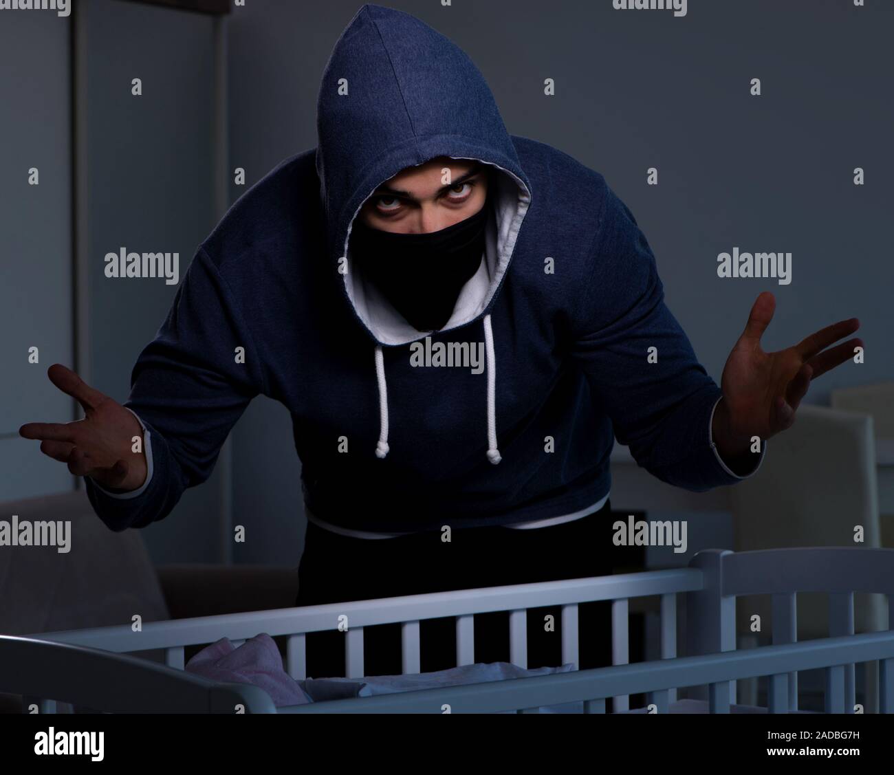 The criminal stealing baby in human child traficking concept Stock ...