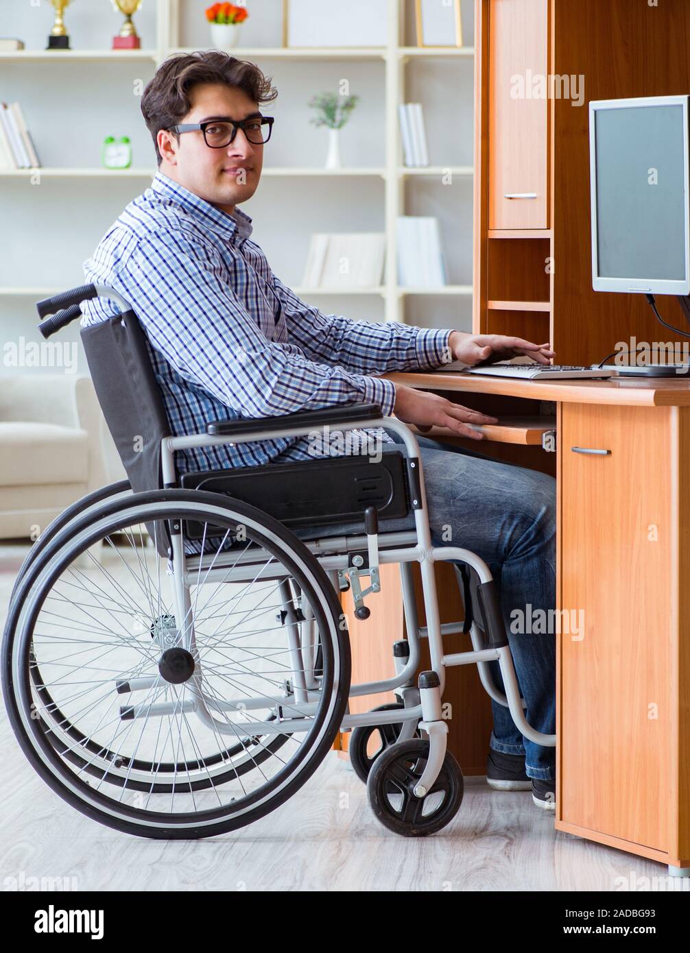 Disabled student studying at home on wheelchair Stock Photo - Alamy