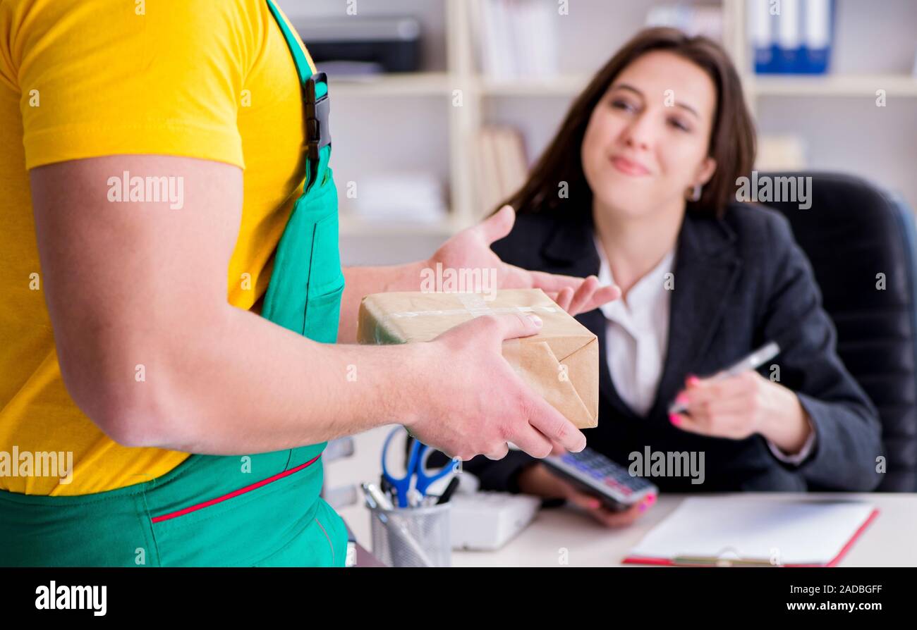 Postman delivering parcel hi-res stock photography and images - Alamy