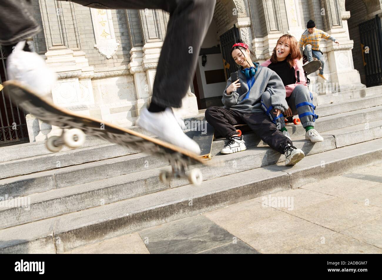 Young people skateboarding Stock Photo - Alamy