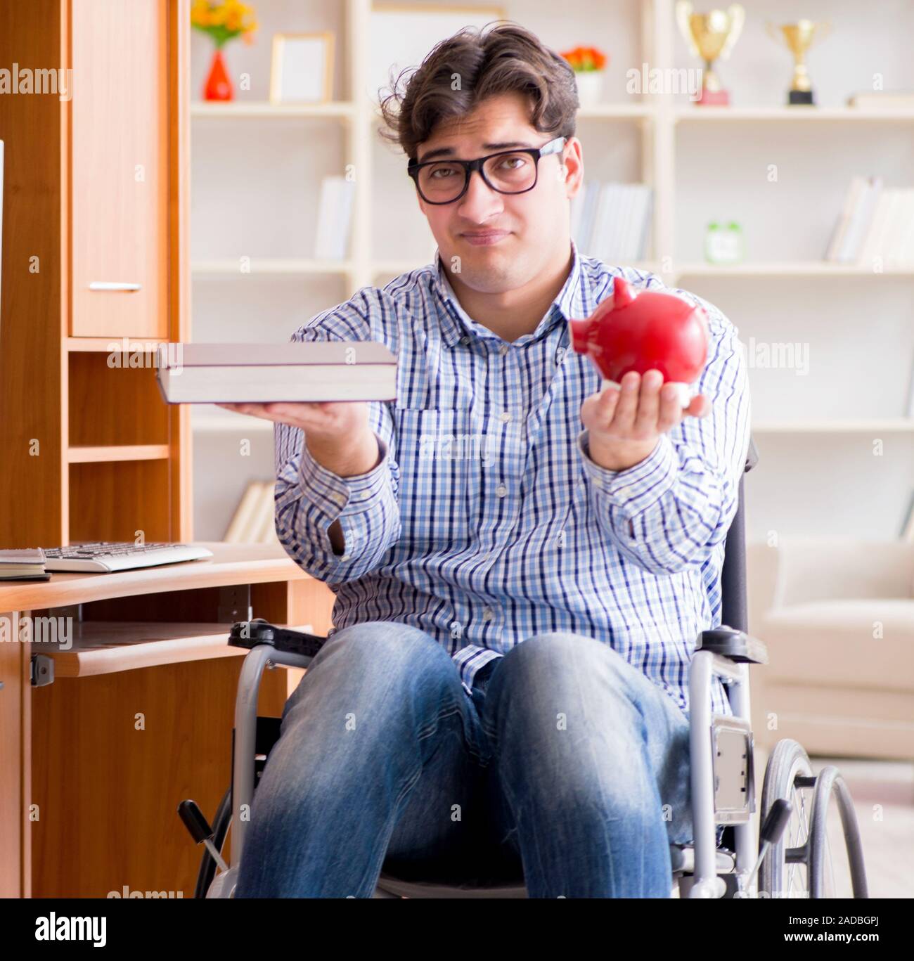 Disabled student studying at home on wheelchair Stock Photo - Alamy