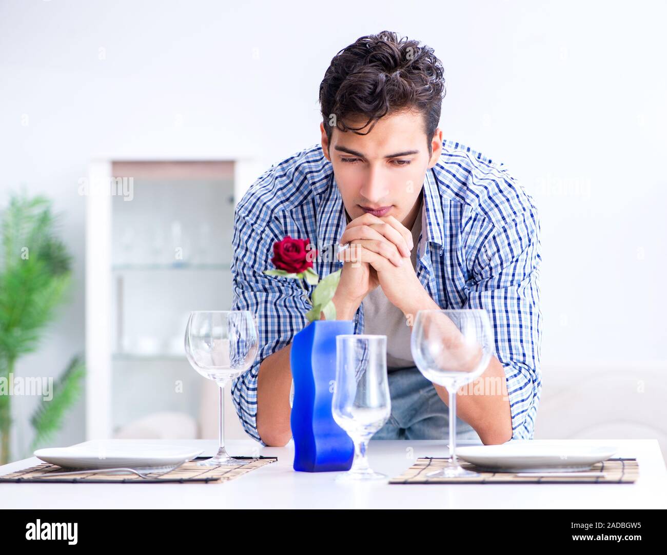 The man alone preparing for romantic date with his sweetheart Stock ...