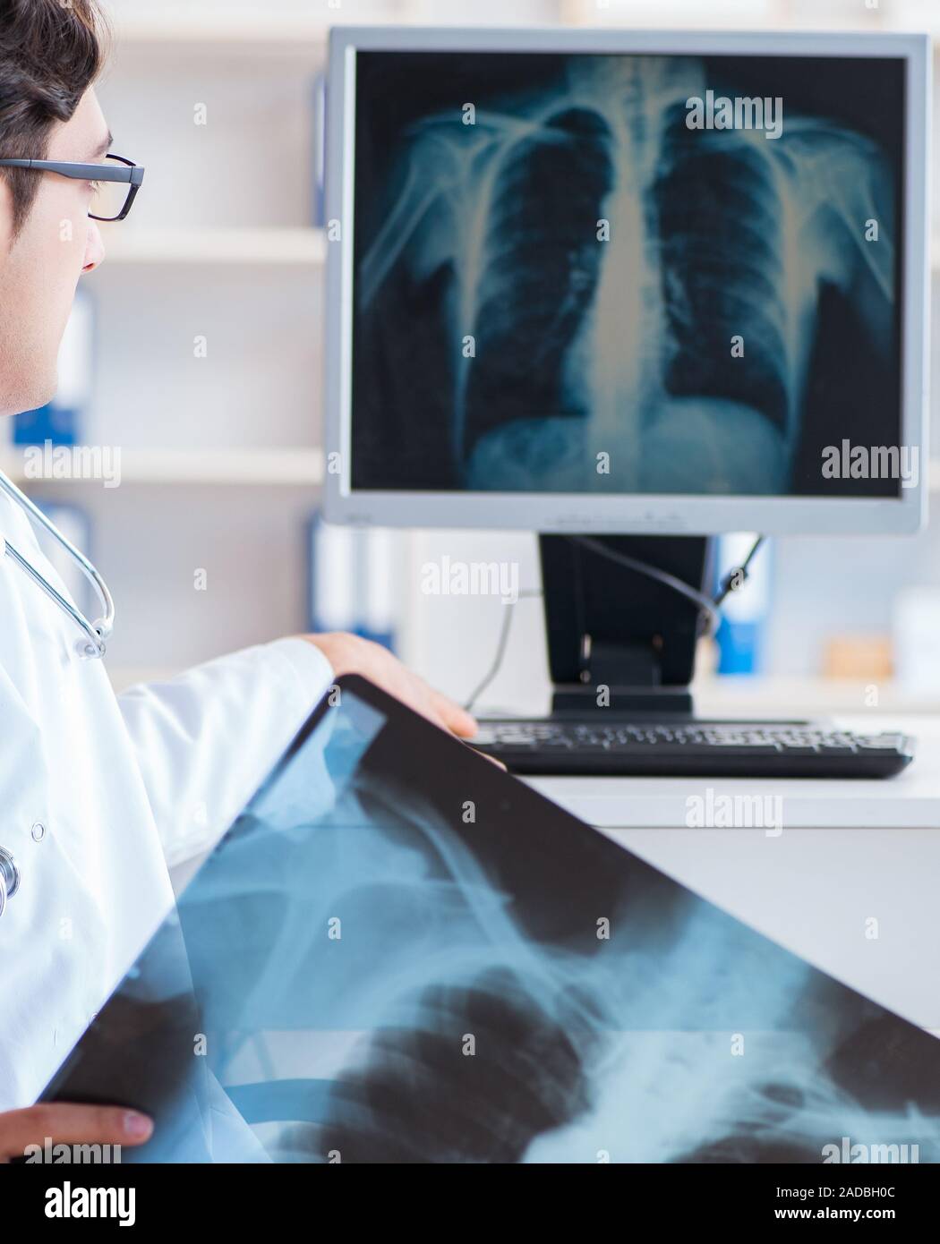 Doctor radiologist looking at x-ray images Stock Photo - Alamy