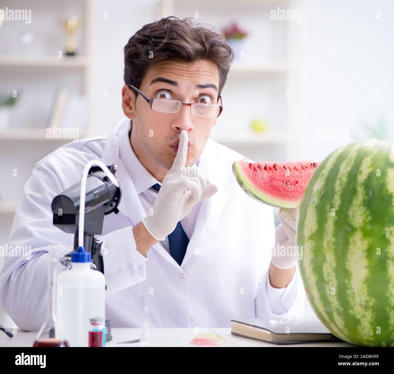 Scientist testing watermelon in lab Stock Photo - Alamy