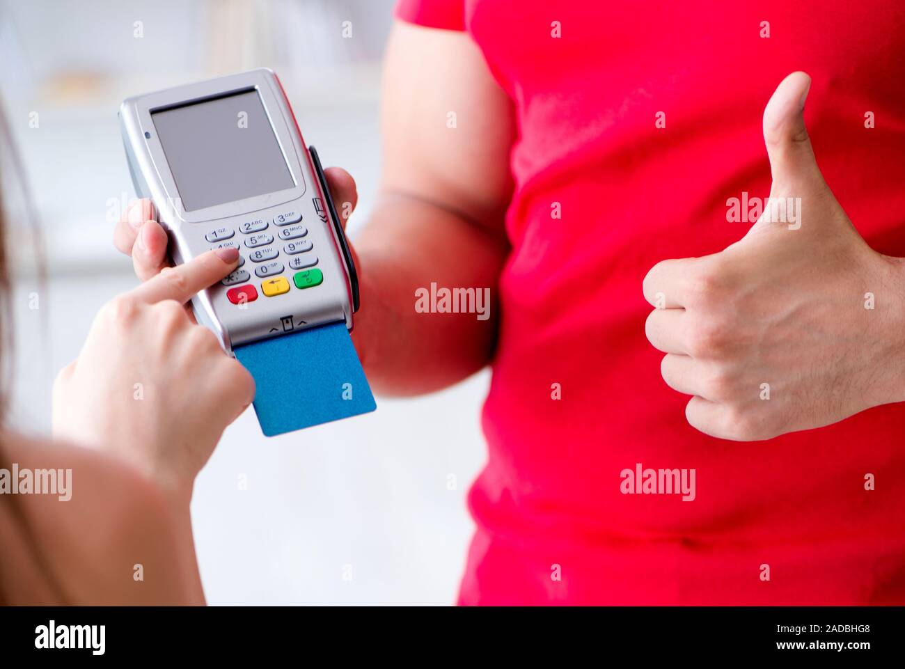 Concept of paying with POS terminal Stock Photo - Alamy