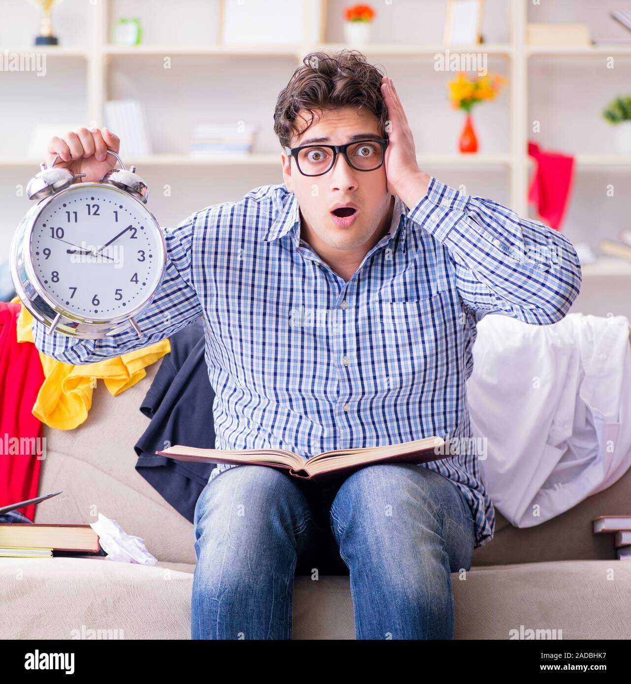Young man working studying in messy room Stock Photo - Alamy