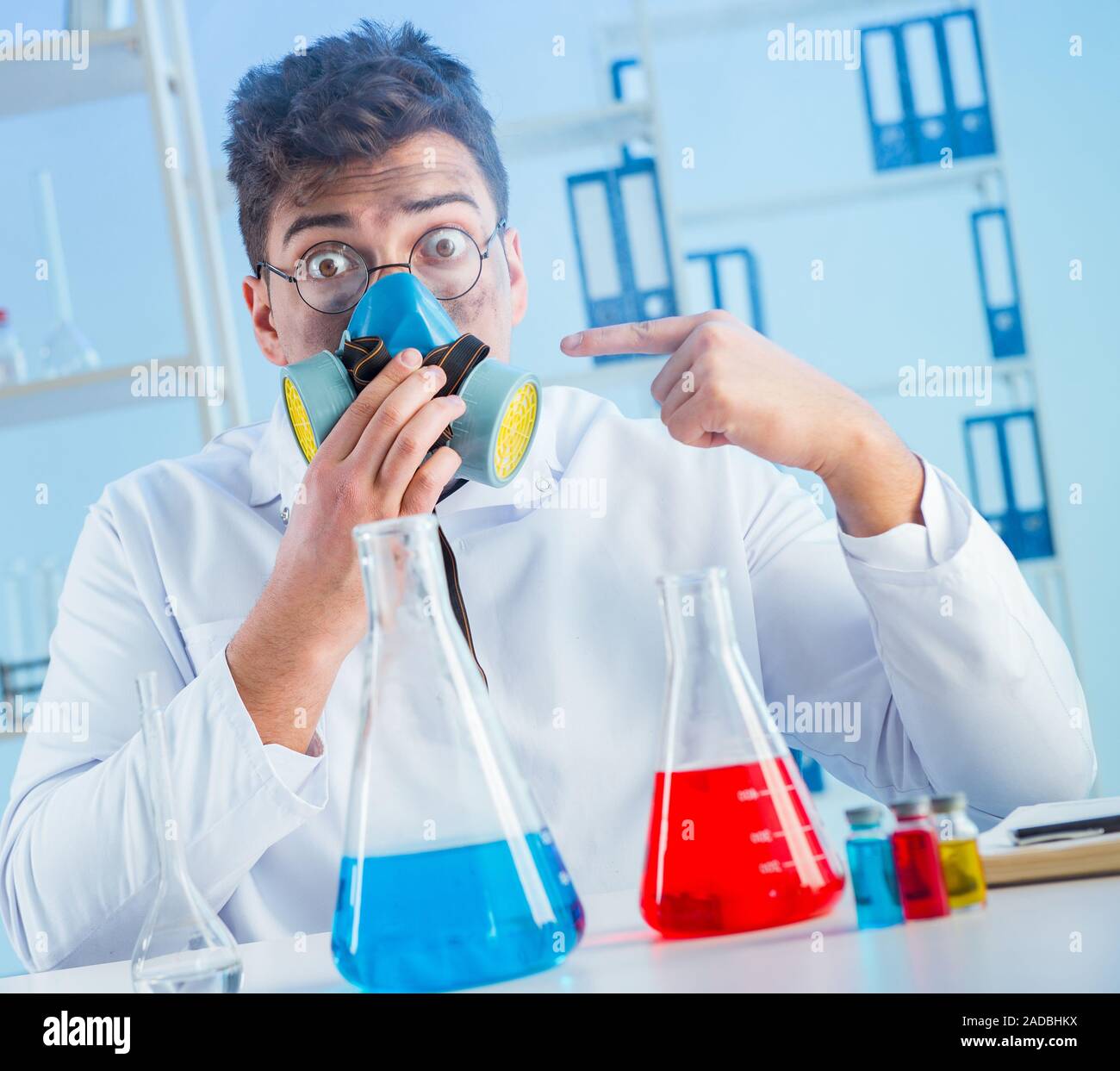 Funny mad chemist working in a laboratory Stock Photo - Alamy