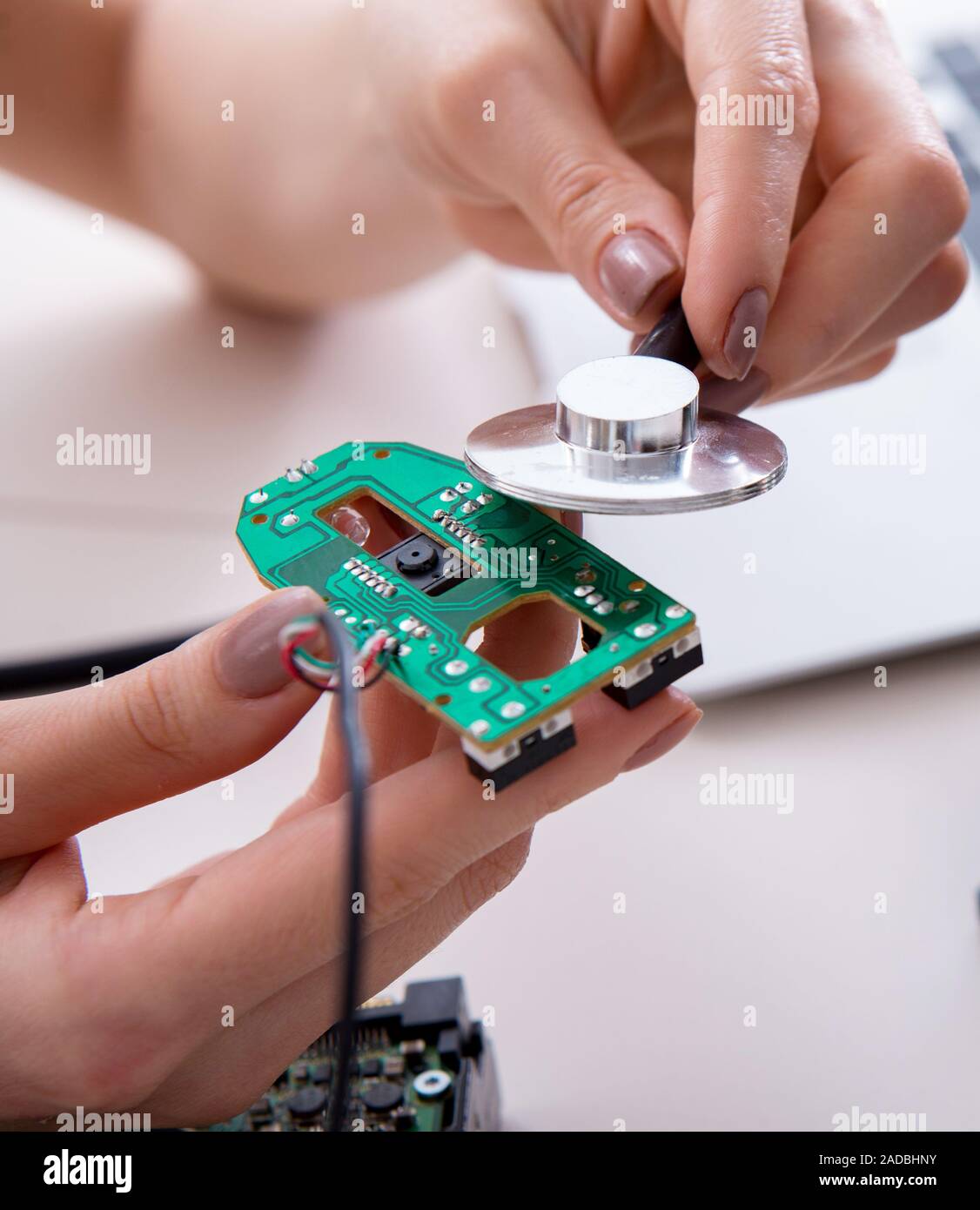 Engineer fixing broken computer hard drive Stock Photo - Alamy